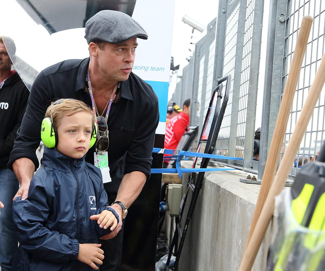Brad Pitt and Knox Jolie-Pitt attend the MotoGP