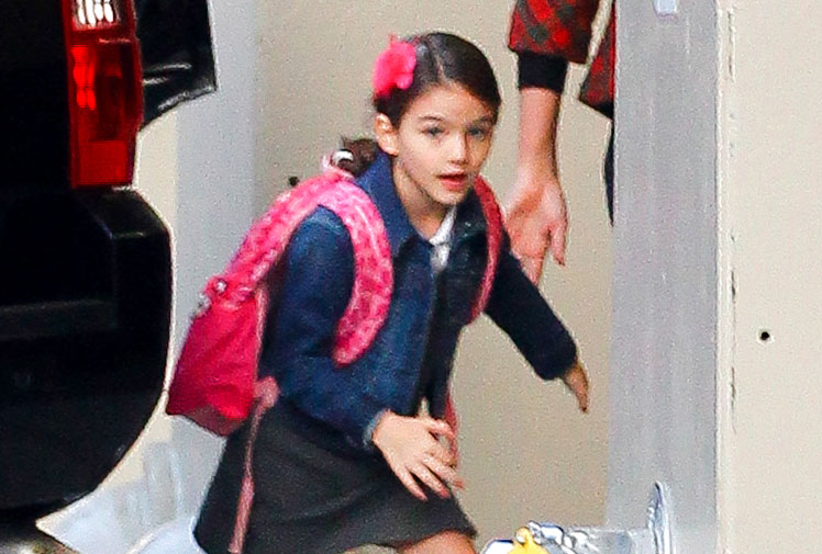 Suri Cruise running to catch the bell at school