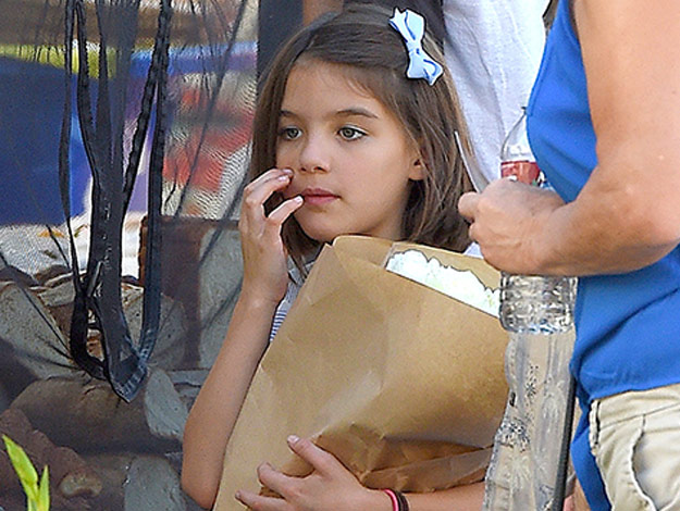 Suri shows off new haircut as she steps out with mum Katie